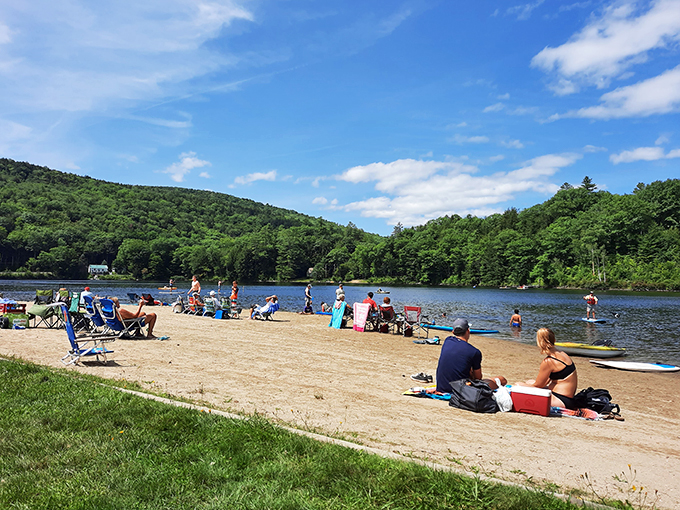 Beach day in Vermont? You betcha! Echo Lake's sandy shore is the perfect spot for sun-seekers and sandcastle architects alike. Coastal vibes in the Green Mountain State!