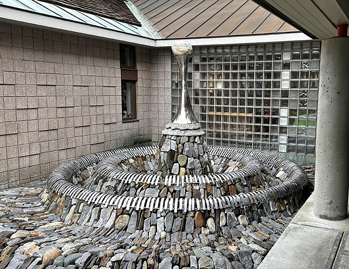 Nature's art installation or scientific marvel? This mesmerizing stone fountain blends form and function, hypnotizing visitors with its swirling design.