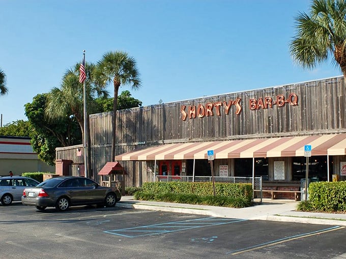 Neon lights, smoky nights! Shorty's rustic charm sets the stage for a mouthwatering journey through BBQ history.