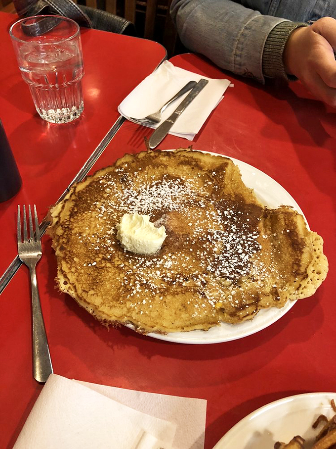 Holy flapjack, Batman! This pancake's so big, it needs its own ZIP code. Fluffy doesn't even begin to describe it.