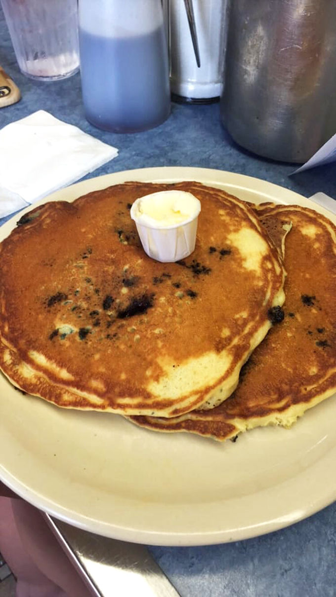 Fluffy clouds of joy! These blueberry pancakes aren't just breakfast, they're a warm hug for your taste buds on a plate.