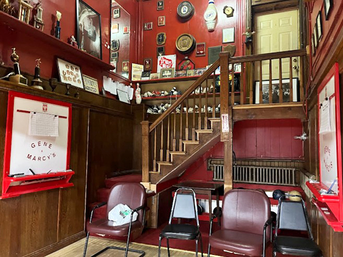 Red walls, wooden stairs, and memories galore. This isn't just decor; it's a scrapbook of good times waiting for you to add your page.