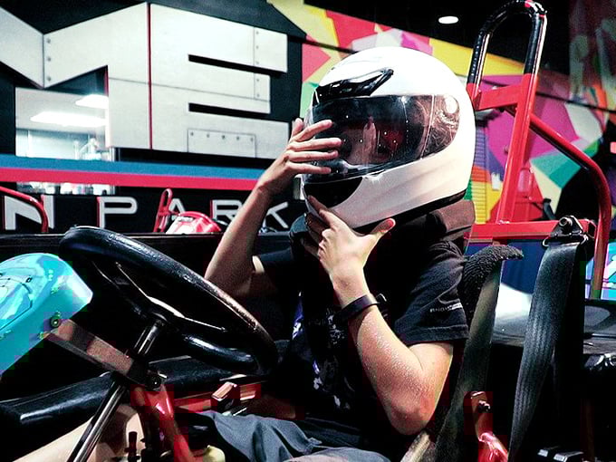 "To infinity and beyond!" Or at least to the finish line. Suiting up for go-kart glory is half the fun.