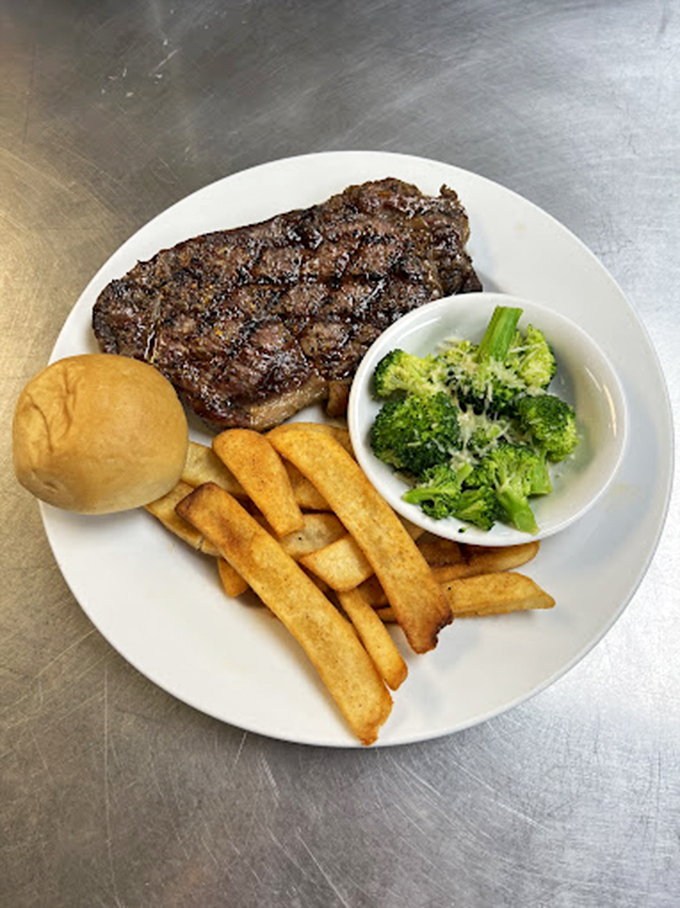 Steak your claim! This prime rib could make a vegetarian weep, flanked by fries so golden they'd make Fort Knox envious.
