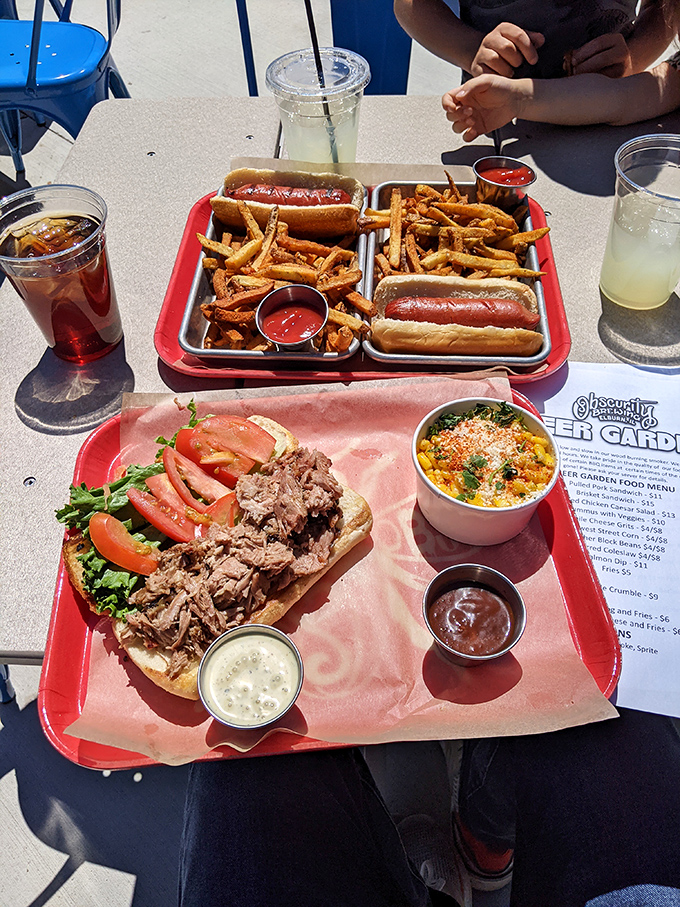 The pulled pork sandwich: Where BBQ dreams come true. Paired with that creamy mac and cheese, it's a combo that'll make your cardiologist weep and your stomach rejoice.