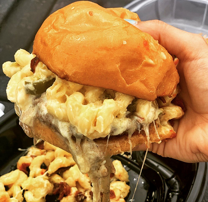 Mac and cheese on a burger? It's like comfort food got a promotion and a corner office. Indulgence, thy name is Rehab.