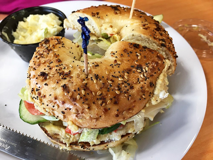 Holy guacamole, Batman! This bagel sandwich is packing more layers than a telenovela plot twist. Deliciousness awaits!