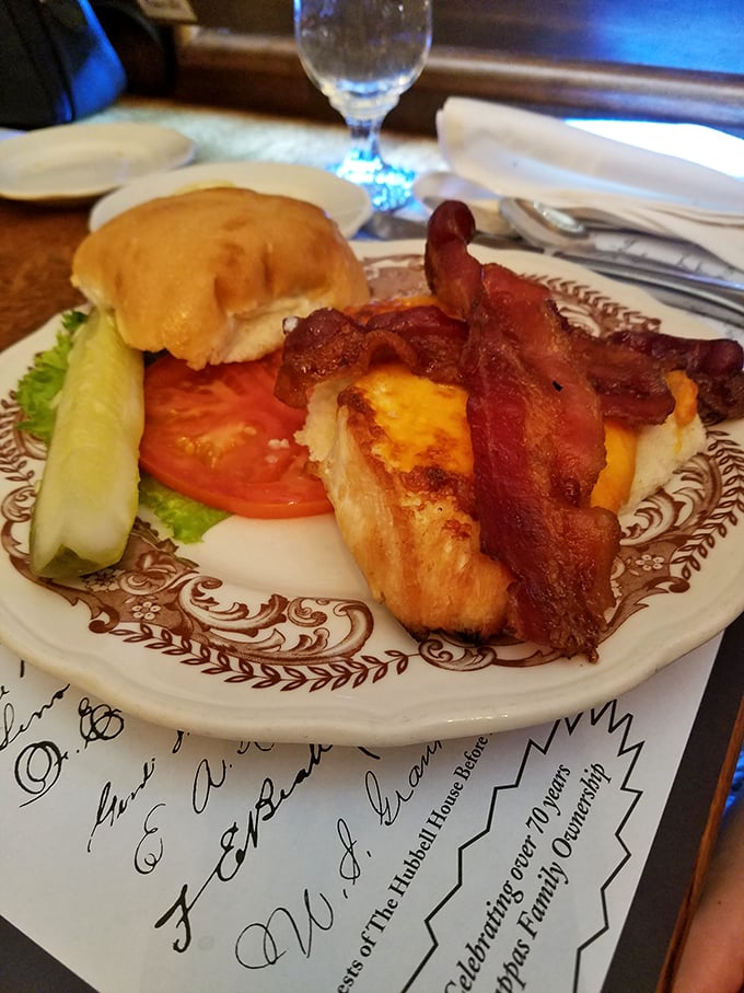 Holy catch of the day! This walleye sandwich is living its best life, dressed up with bacon like it's heading to a fish fry gala.