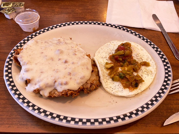 Southern comfort on a plate! This chicken fried steak could make even a cactus weep with joy. Gravy so good, you'll want to bathe in it.