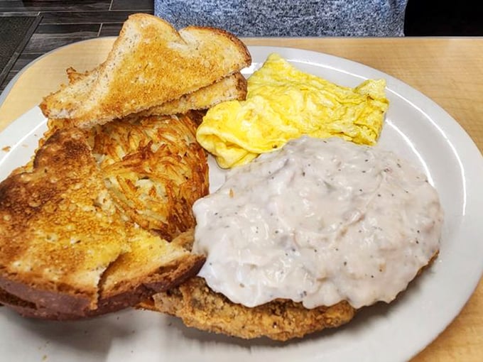 Holy crispy goodness, Batman! This chicken fried steak is so golden and crunchy, it could give Fort Knox a run for its money. Paired with eggs and hash browns, it's a breakfast of champions.