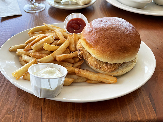 The Haddock Sandwich: where the ocean meets the farm. Golden-fried fish nestled in a pillowy bun, with crispy fries standing guard &ndash; a coastal classic!