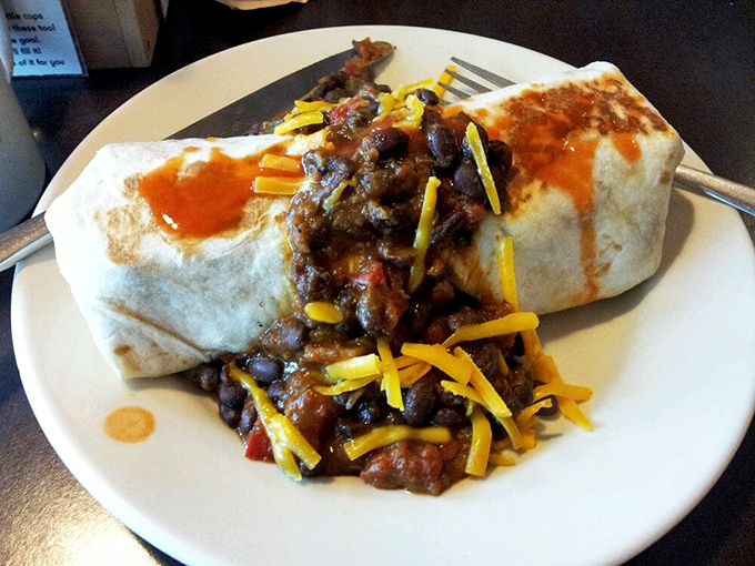 Holy guacamole! This burrito is so stuffed, it's practically doing bicep curls. Prepare for a flavor fiesta in every bite.