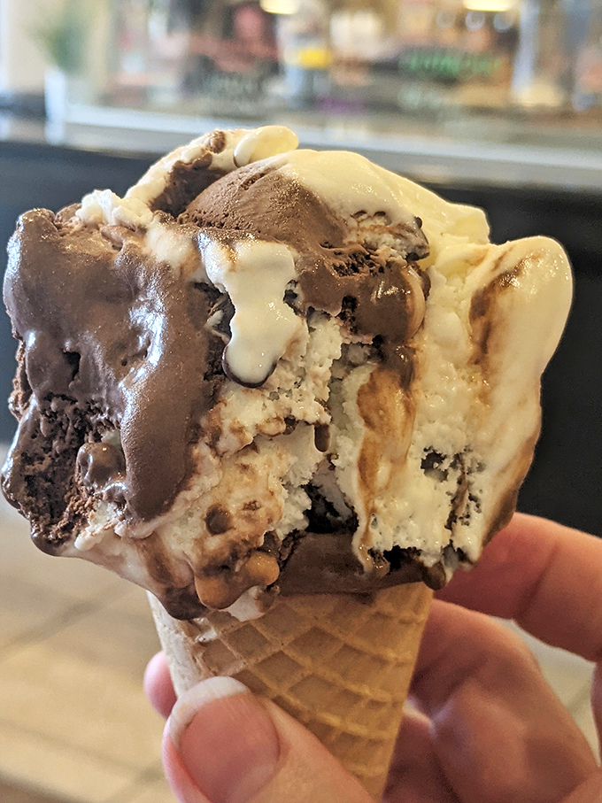 Holy cow, that's a scoop! This ice cream cone is stacked higher than my hopes for winning the lottery.
