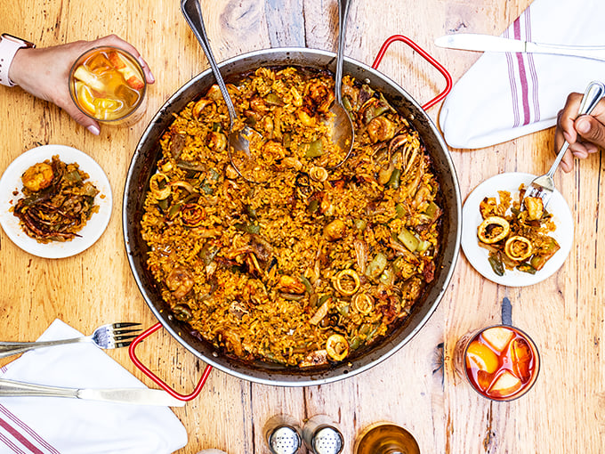 Behold, the crown jewel of Spanish cuisine! This paella is so colorful, it could double as a Miró painting.