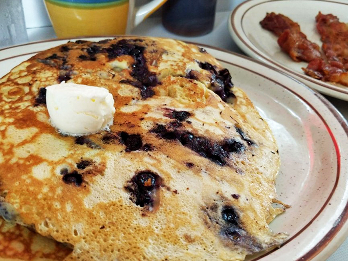 Blueberry bonanza! These pancakes are so packed with berries, they could moonlight as a fruit salad in disguise.