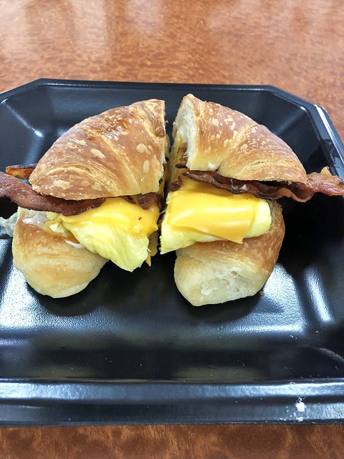 Behold, the breakfast sandwich that puts your sad desk lunch to shame. Flaky croissant, gooey cheese, and perfectly cooked eggs &ndash; it's love at first bite.