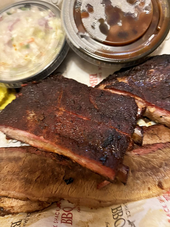 Behold, the holy grail of barbecue! These ribs and brisket are so good, they might make you forget your table manners.