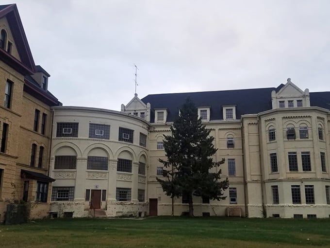 "Who needs a moat when you've got architectural flair?" This wing of the building looks ready to take flight. Medieval castle meets Victorian charm!