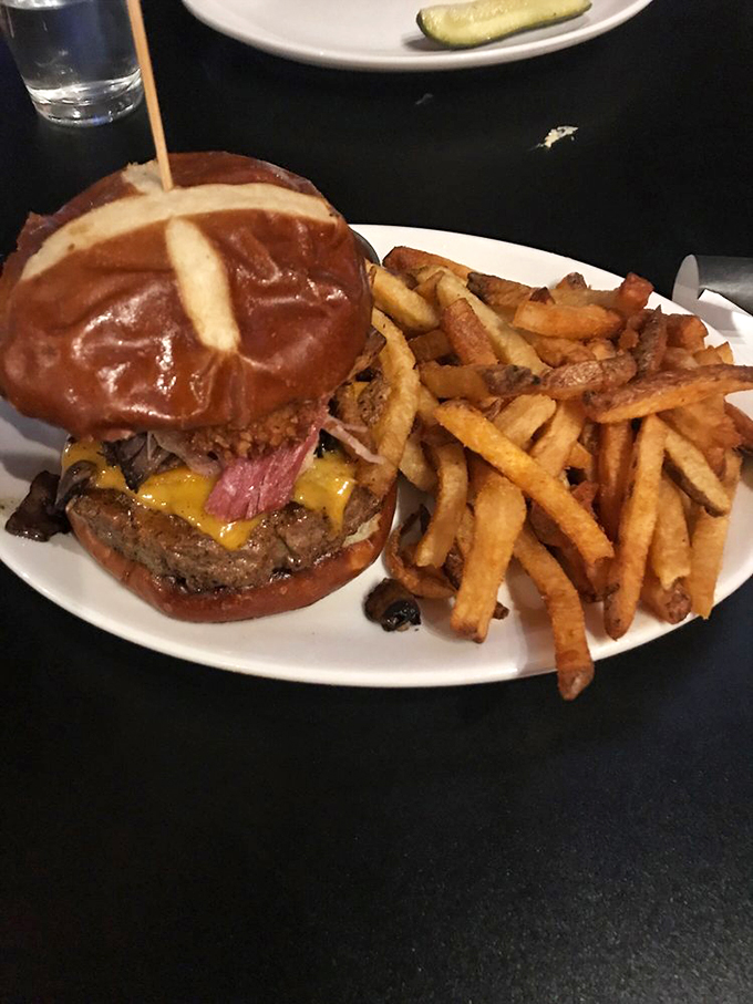 Feast your eyes on this beefy behemoth! It's not just a burger; it's a towering testament to culinary creativity.