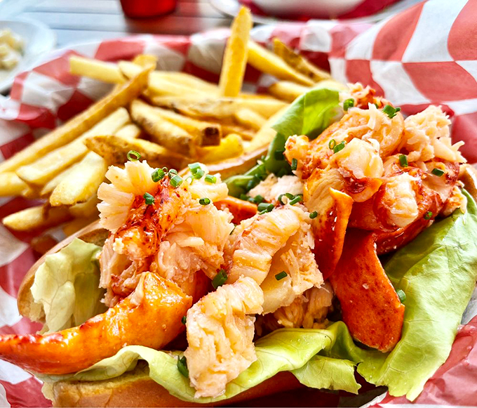 Holy crustaceans, Batman! This lobster roll is bursting with so much meat, it's practically doing bicep curls. 
