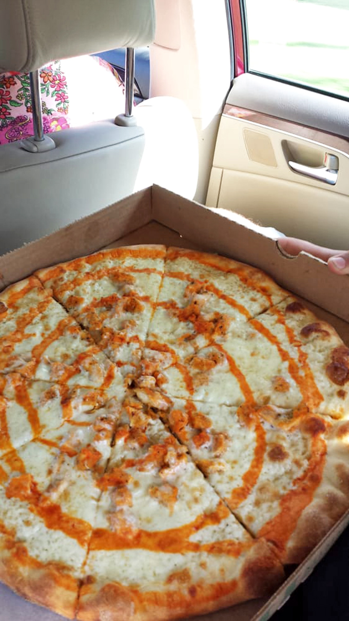 "Road trip fuel, Italian style." This pizza's swirls of sauce and toppings are like a delicious work of abstract art, perfect for devouring on the go.