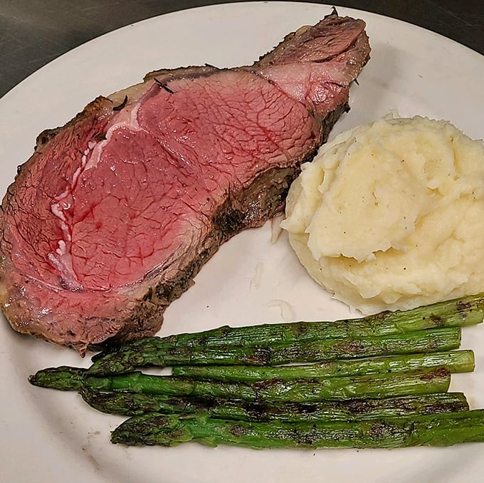 Prime rib so tender, it practically melts on your fork. Paired with those creamy mashed potatoes, it's a carnivore's dream come true.