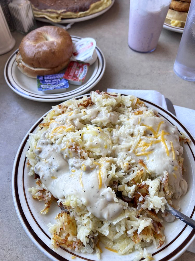 Holy hash browns, Batman! This cheesy, gooey mountain of potato perfection looks like it could fuel an entire Packers offensive line. Fork not included &ndash; you might need a shovel.