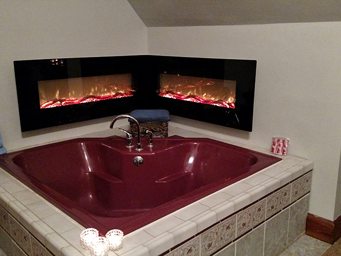 Bubble, bubble, toil and... luxury? This crimson tub with fireplace view puts the 'aah' in spa day. Medieval pampering at its finest!