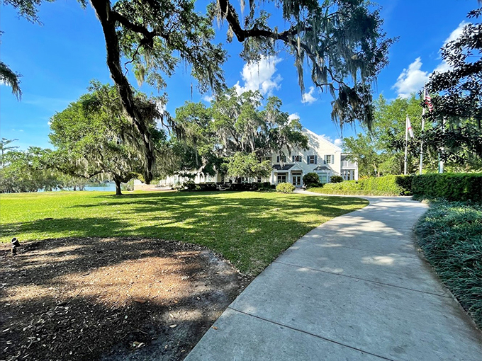 Southern charm meets tropical flair. This historic home is ready for its close-up, surrounded by nature's finest landscaping.
