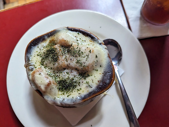 Cheese pull for the soul! This French onion soup is so good, it might just solve world peace... one spoonful at a time.