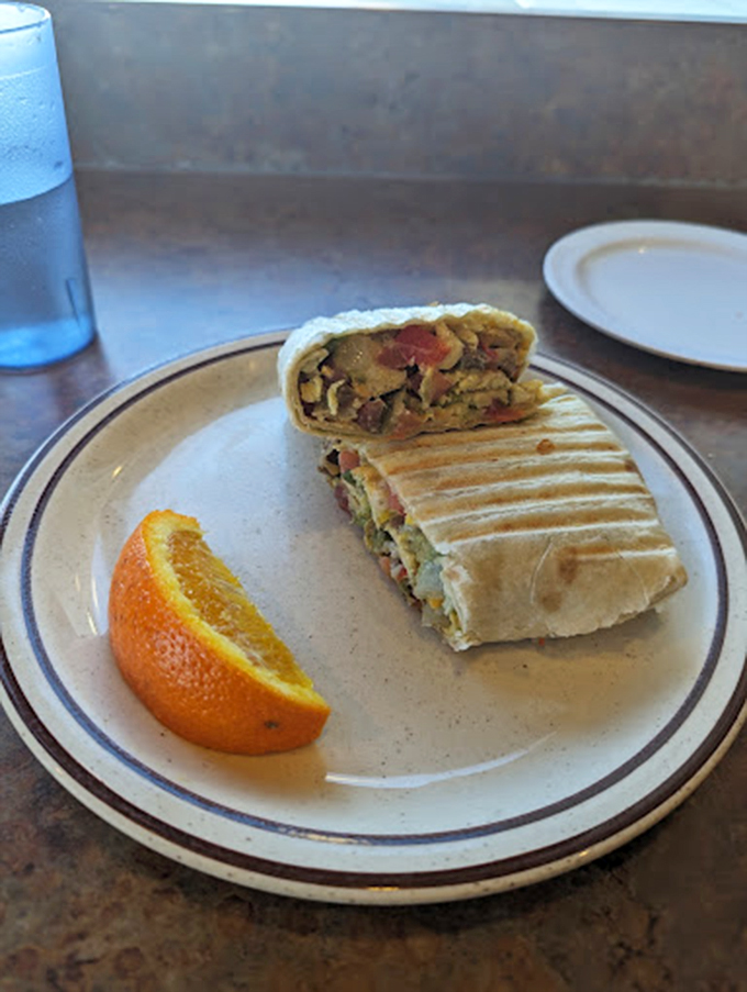 Behold, the breakfast burrito in all its glory! Packed tighter than your grandma's suitcase, it's a flavor fiesta waiting to happen.