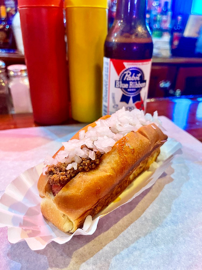 Behold, the Coney in all its glory! This bad boy's dressed to impress, ready to make your taste buds do a happy dance.