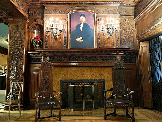 Forget man caves, this fireplace is giving us "aristocrat's lair" vibes. I half expect Sherlock Holmes to pop out with a pipe and a mystery.