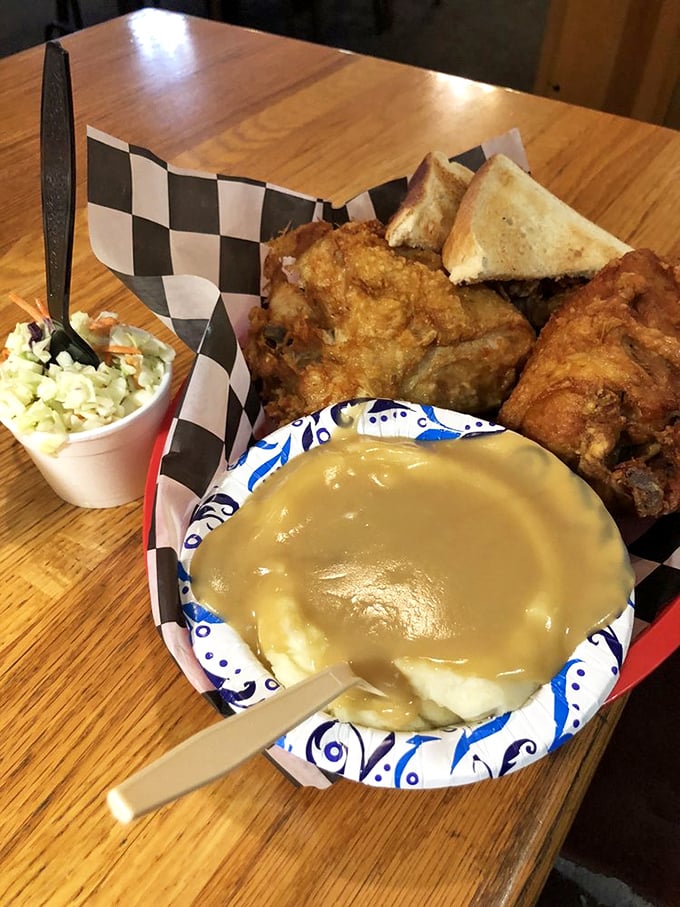 Fried chicken and coleslaw: A duo more iconic than Prince and his purple guitar. The Brass Rail nails this classic combo.