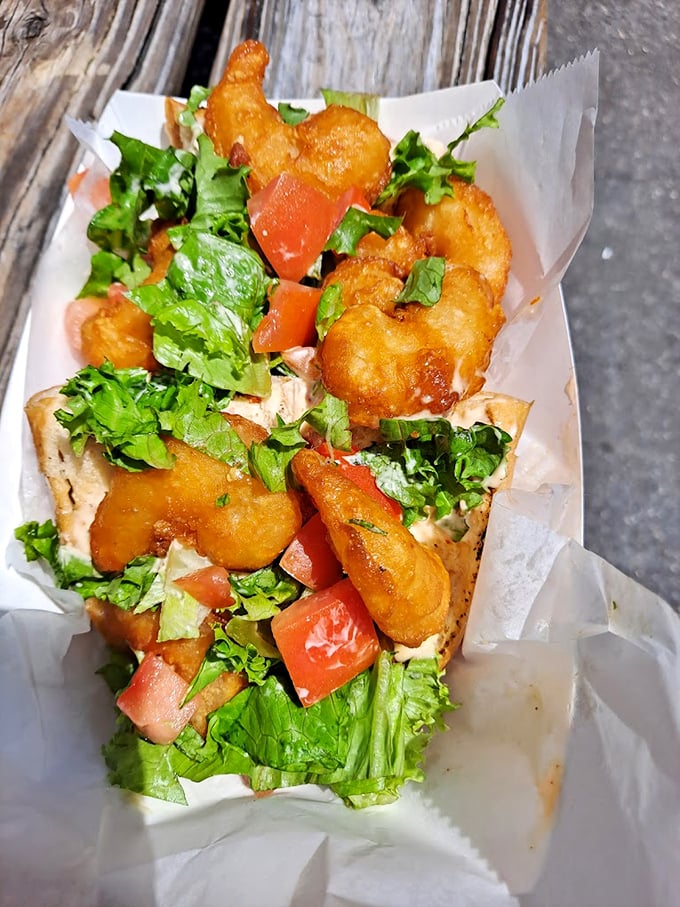 A sandwich that's not afraid to show off. This fried shrimp po' boy is dressed to impress with a garden of fresh toppings.