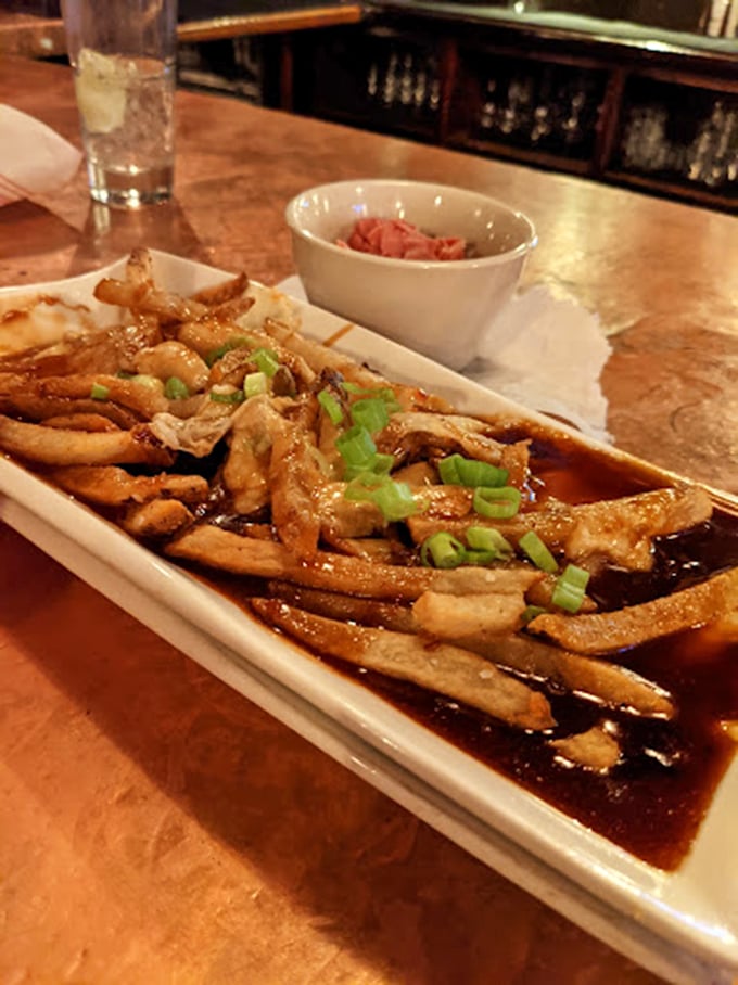 When poutine and coleslaw join forces, it's like a delicious United Nations of comfort food on your plate.