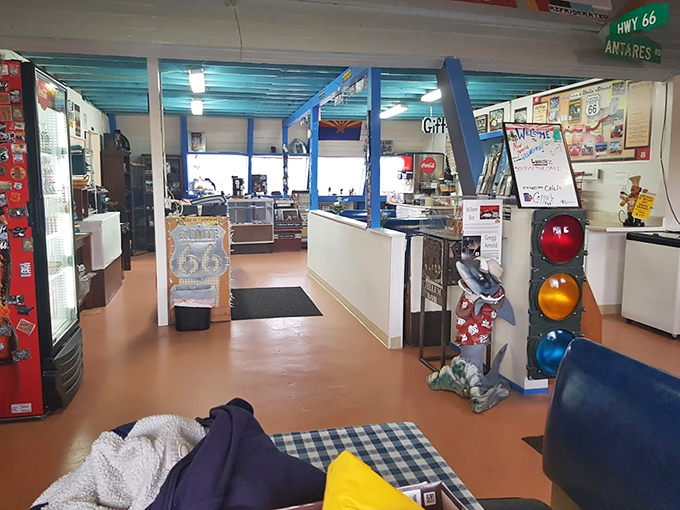 It's as if the 1950s exploded in here, in the best possible way. From world maps to vintage signs, every inch tells a story of America's love affair with the open road.