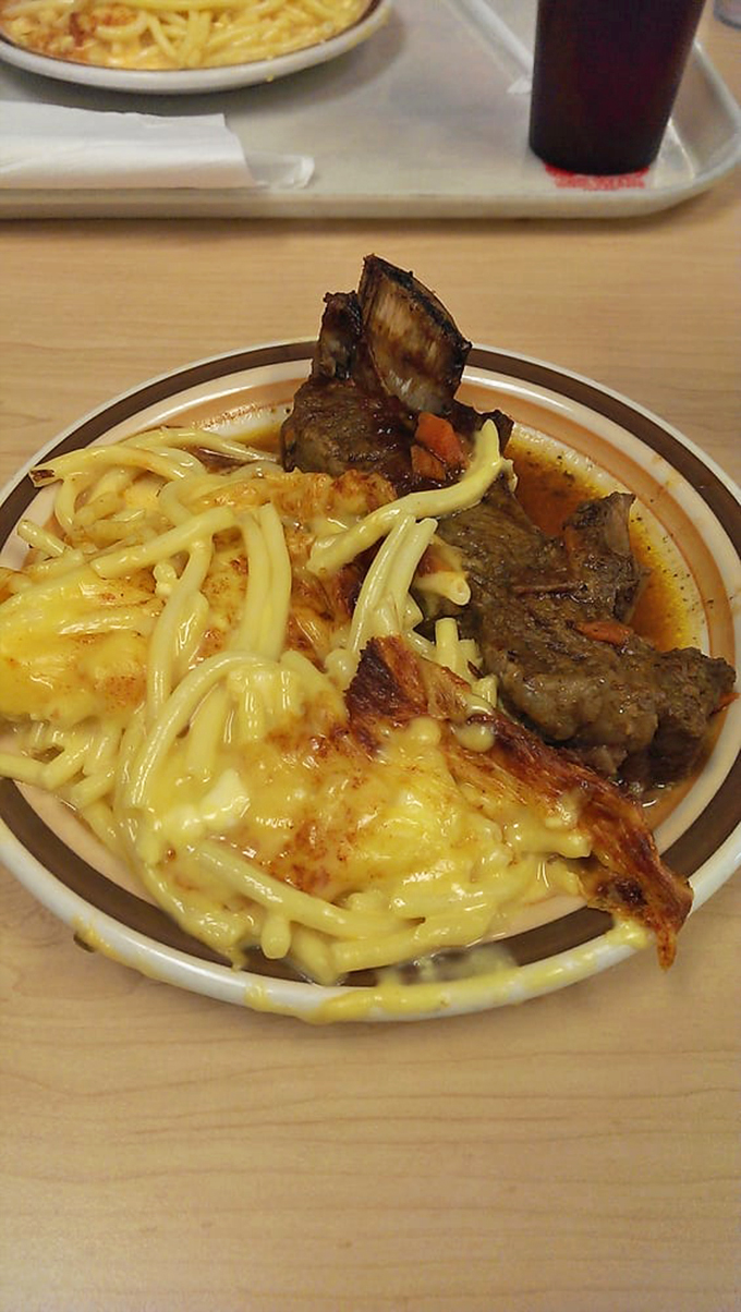 Mac and cheese meets short ribs in a dance of decadence. It's like a hug for your taste buds, if hugs were made of carbs and protein.