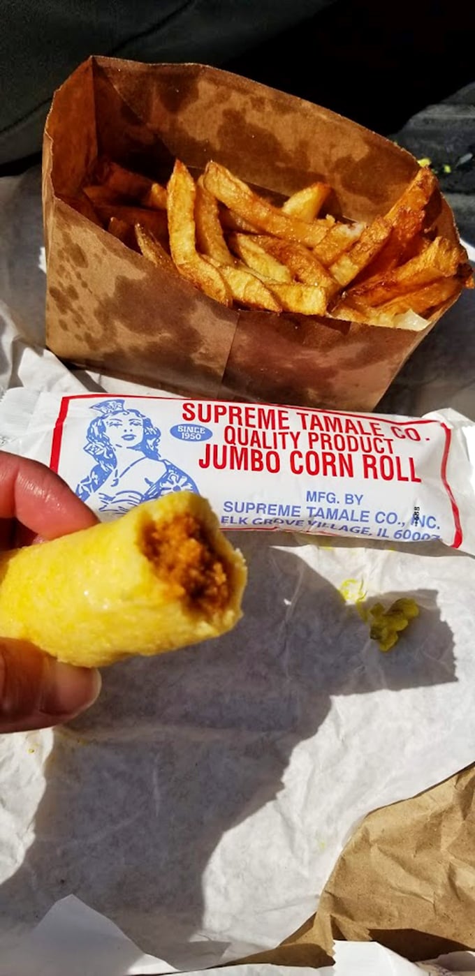 The dynamic duo: crispy fries and a plump tamale. It's like Batman and Robin, if they were delicious and wrapped in paper.