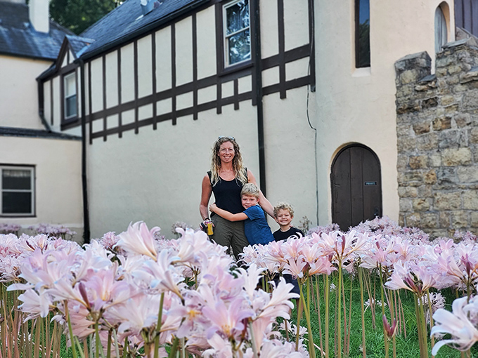 Flower power meets castle tower. These blooms are so vibrant, they might just outshine the stone walls behind them.