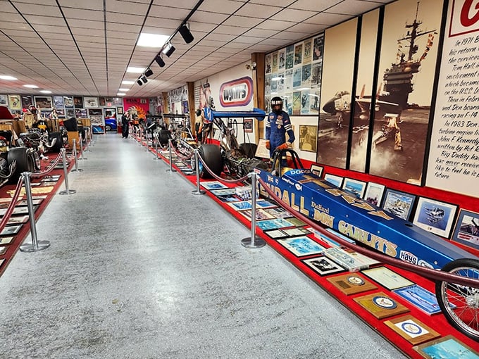 Where nostalgia meets nitromethane! This display takes you on a journey through drag racing history, one gleaming fender at a time.