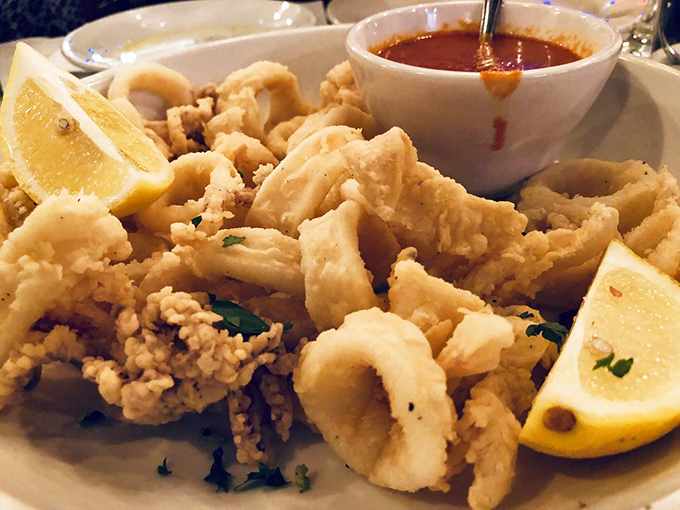 Calamari so light and crispy, it practically floats off the plate. Paired with that zesty sauce, it's a match made in seafood heaven.