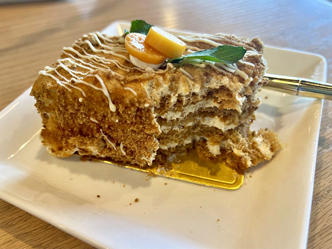 Honey, I shrunk the cake! This slice of heaven looks like it could solve all of life's problems, one forkful at a time.