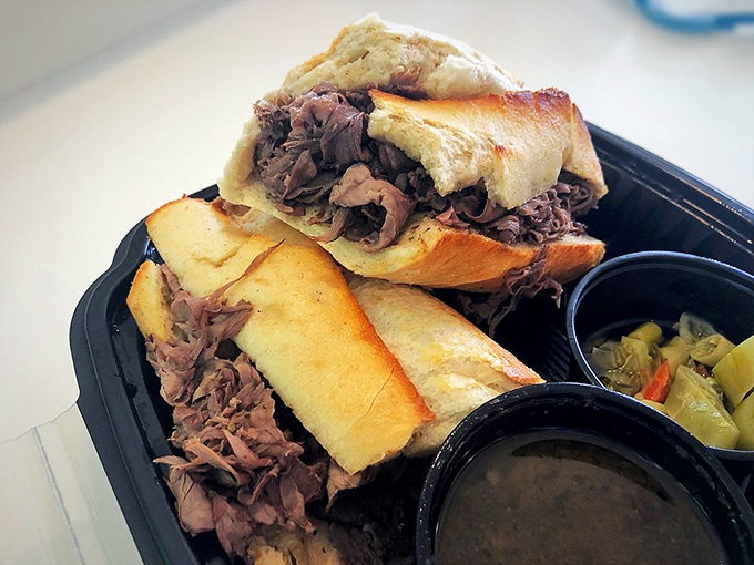 Talk about a beefy situation! This Italian beef sandwich is piled so high, it's like a delicious game of Jenga. Napkins required, no judgment given.