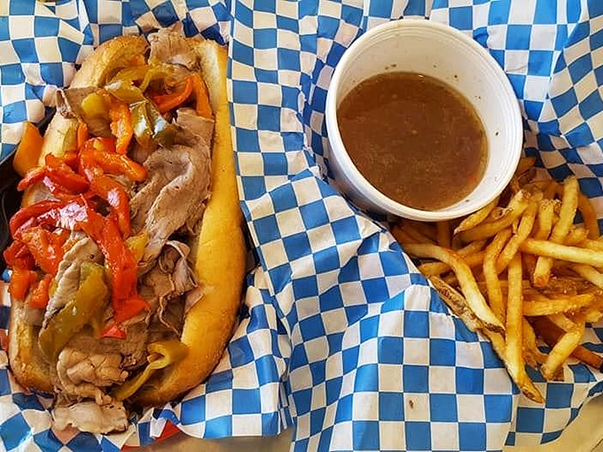 The Italian sub: where bread meets an avalanche of meaty goodness. It's like a hug for your taste buds, wrapped in checkered paper.