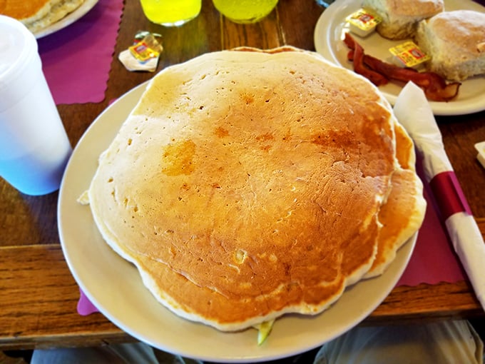 Holy flapjacks, Batman! This pancake is giving "cover the entire plate" a whole new meaning. Syrup not included, but highly recommended.