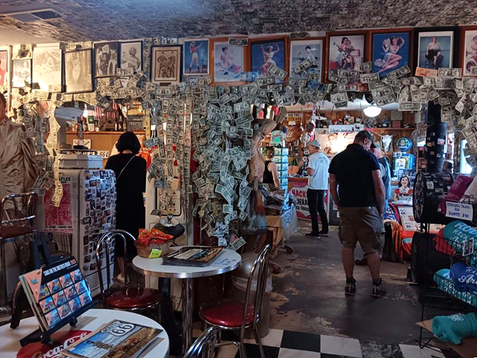 Shoppers or time travelers? In Hackberry General Store, it's hard to tell! These folks are browsing through decades of road trip history, probably looking for that perfect souvenir to prove they were here.