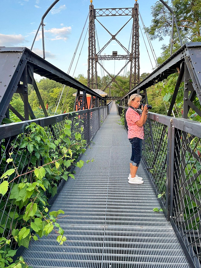 Capturing memories, one step at a time: Visitors pause to photograph the bridge, proving some things are worth more than just two cents.