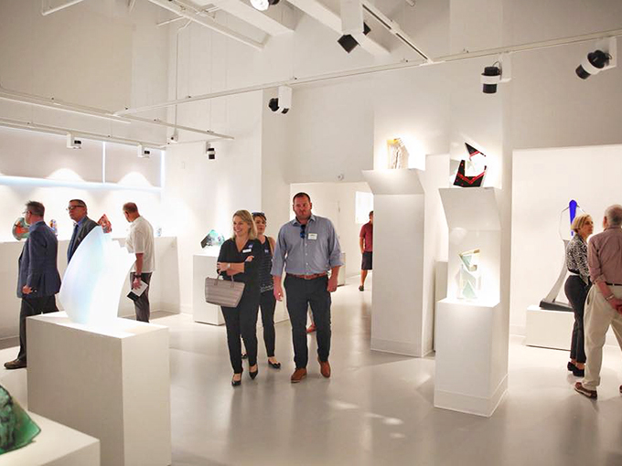 Art appreciation in action! These folks are so engrossed, you'd think the sculptures were giving away free samples of eternal youth.