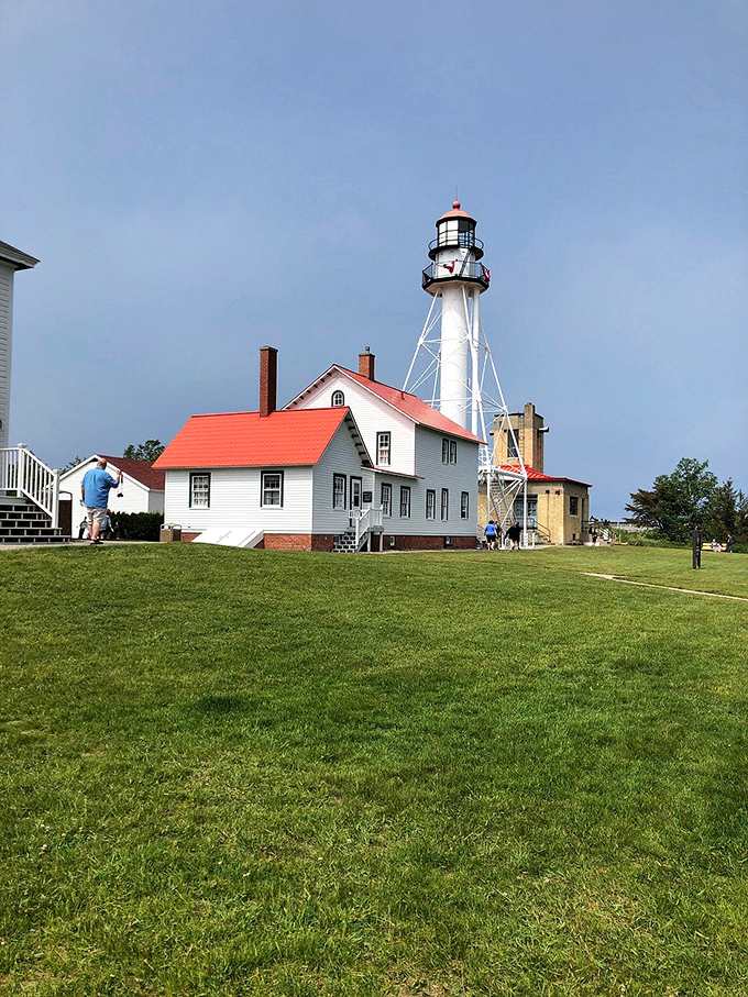 Lighthouse selfie central! Visitors strike their best "I'm on a boat" poses, minus the actual boat.